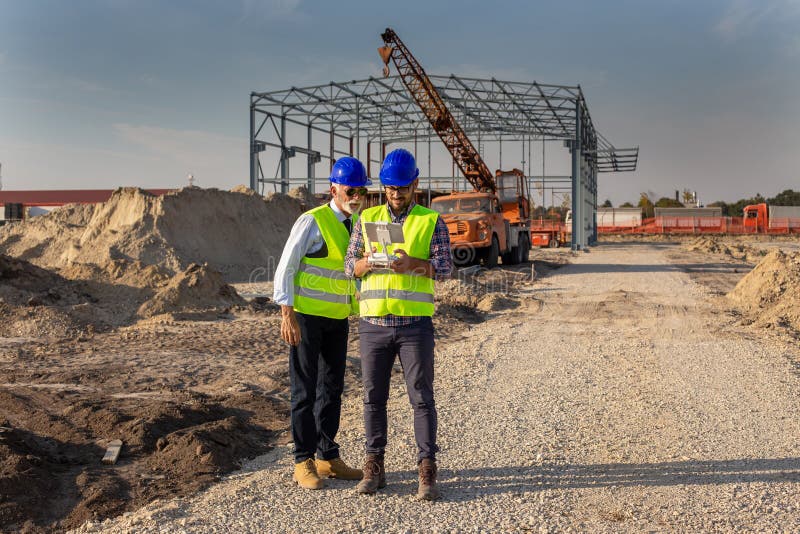 Construction Engineers with Drone at Building Site Stock Photo - Image ...