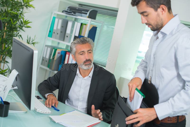 Construction Engineers Talking about Modifications Building Plan Stock ...