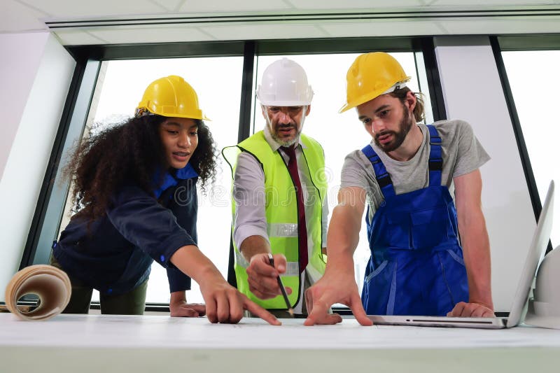 Construction Engineers Team Using Blueprint of Project Plan Stock Image ...