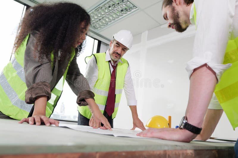 Construction Engineers Team Using Blueprint of Project Plan Stock Photo - Image of control, high ...