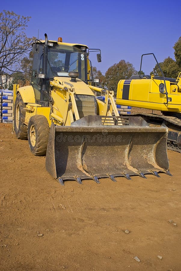 Construction Equipment in Yard Stock Photo - Image of hydraulic, heavy ...