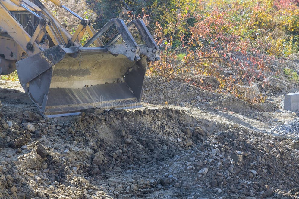 Construction Excavator Leveling Ground for Constructing a Roadwork ...