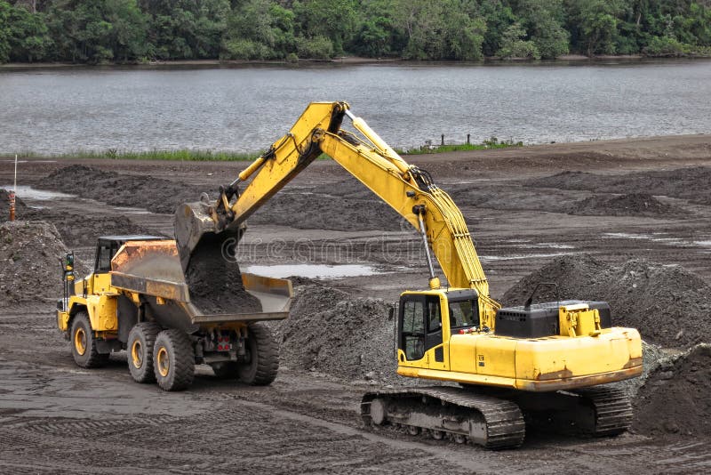 Construction Excavator Loading Dirt into Truck Stock Image - Image of ...