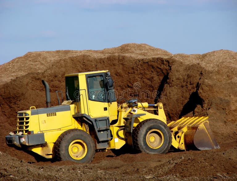 Construction Excavator and Scooper in Pile of Dirt Stock Photo - Image ...