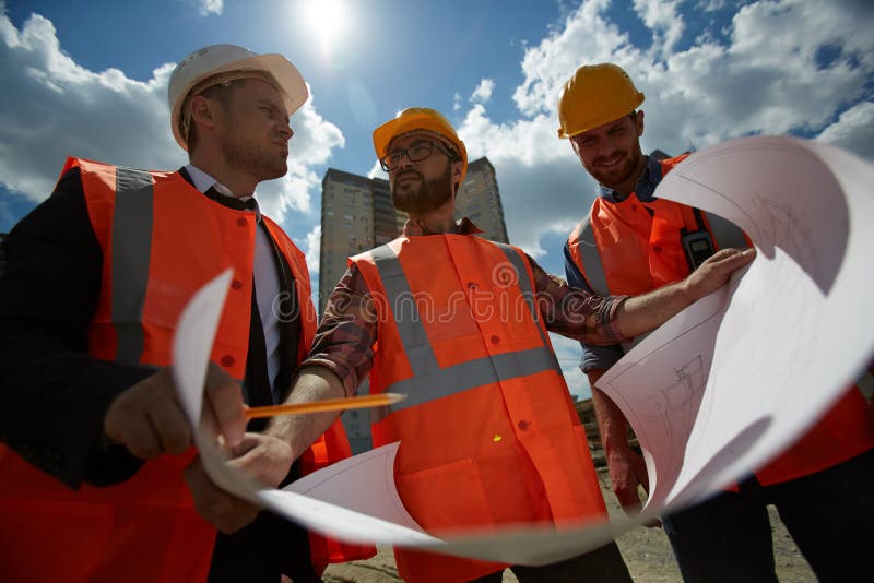 Construction Experts on Site Stock Image - Image of discussing, vest ...