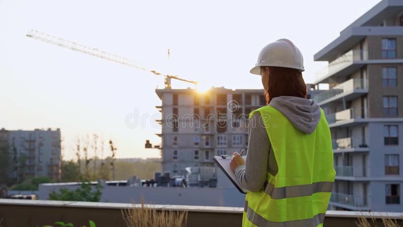 Construction Female Engineer Taking Notes and Writing on Clipboard ...