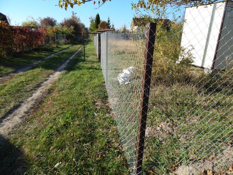 Construction of a Fence from a Chain-link Grid Stock Image - Image of ...