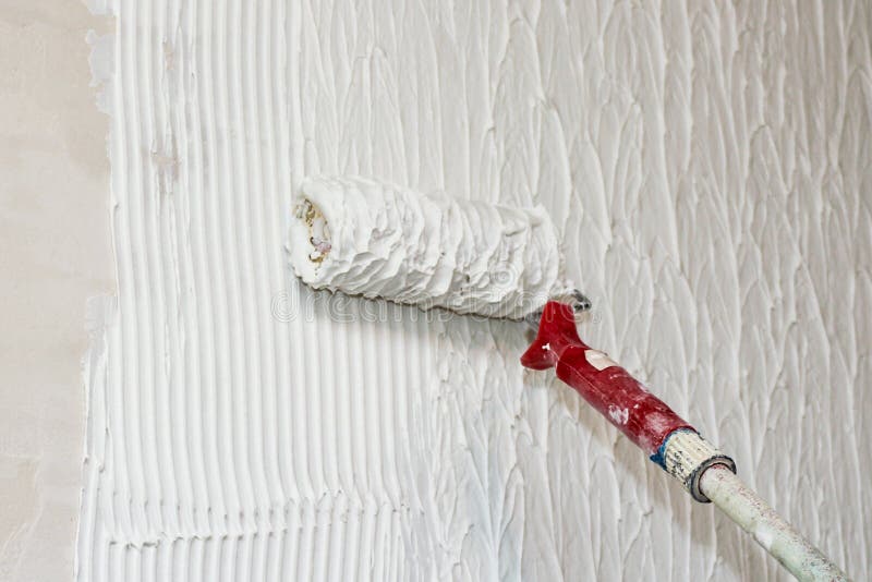Making Decorative Plaster Using a Roller Stock Photo - Image of plaster ...