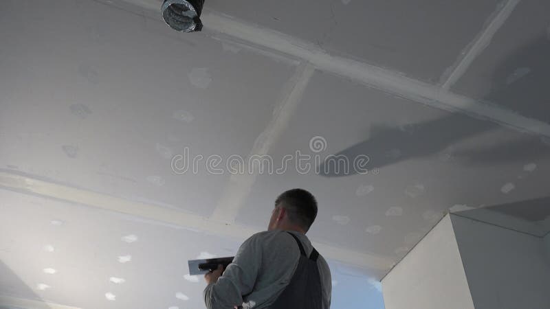 Handyman Man Spackling Gypsum Plasterboard Ceiling with Putty Stock ...
