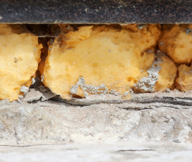 Construction Foam in the Wall Slit As a Background Stock Photo - Image ...