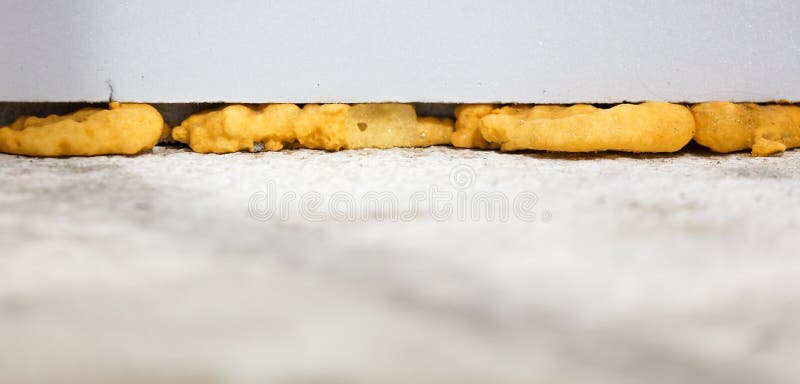 Construction Foam in the Wall Slit As a Background Stock Photo - Image ...