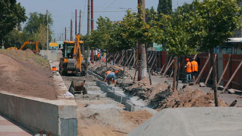 Construction of a Footpath. the Tractor Performs Construction Work. the ...