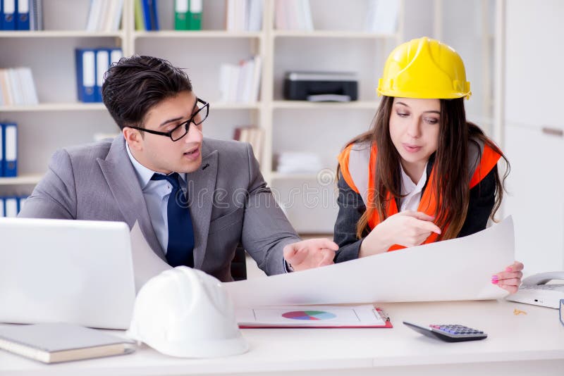 The Construction Foreman Supervisor Reviewing Drawings Stock Photo ...