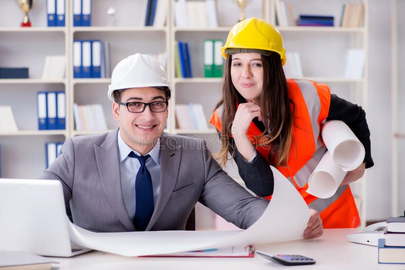 The Construction Foreman Supervisor Reviewing Drawings Stock Photo ...