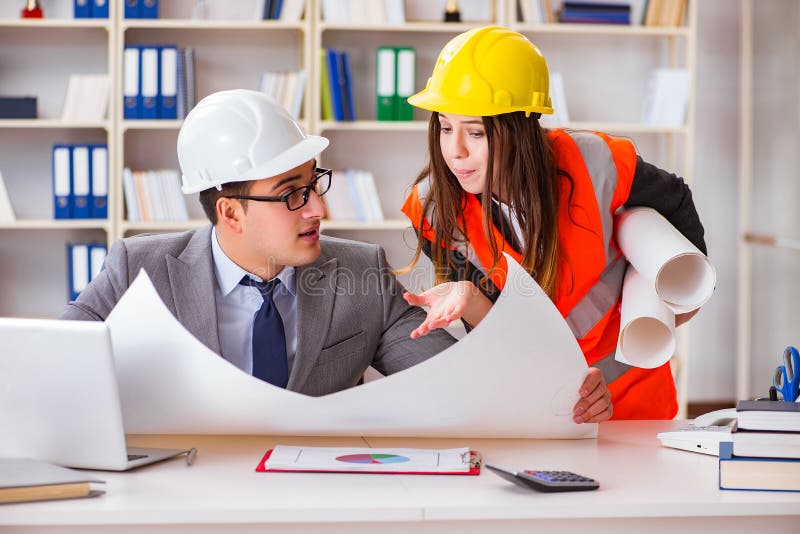 The Construction Foreman Supervisor Reviewing Drawings Stock Photo ...