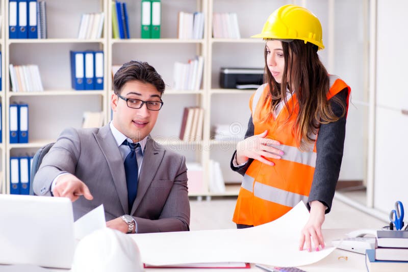 The Construction Foreman Supervisor Reviewing Drawings Stock Photo ...
