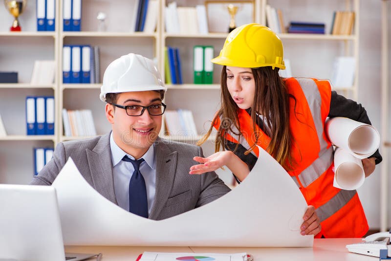 The Construction Foreman Supervisor Reviewing Drawings Stock Photo ...