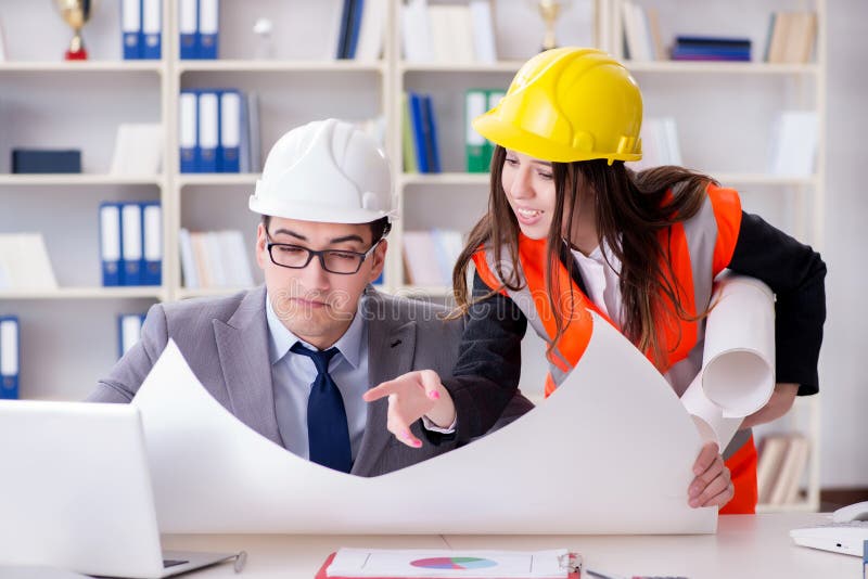 The Construction Foreman Supervisor Reviewing Drawings Stock Image ...
