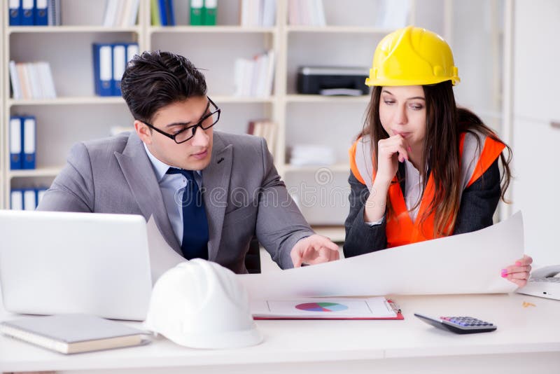 The Construction Foreman Supervisor Reviewing Drawings Stock Photo ...
