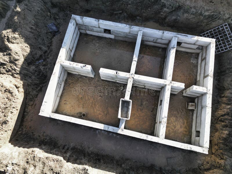 Construction of the Foundation of the Building from Concrete Blocks ...