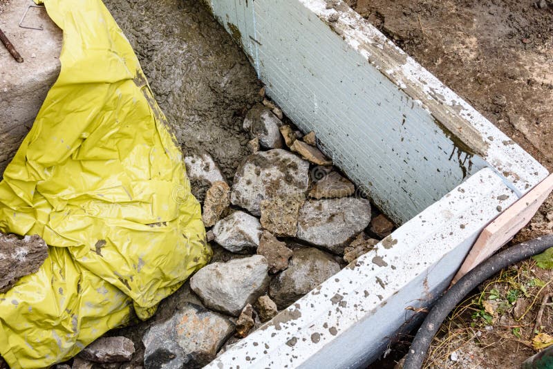 Construction of the Foundation for House. Pouring of Concrete Stock ...