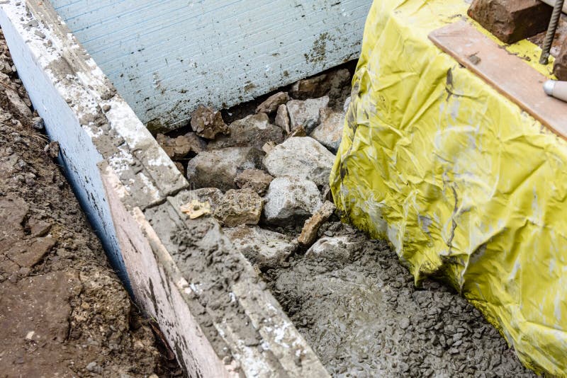 Construction of the Foundation for House. Pouring of Concrete Stock ...