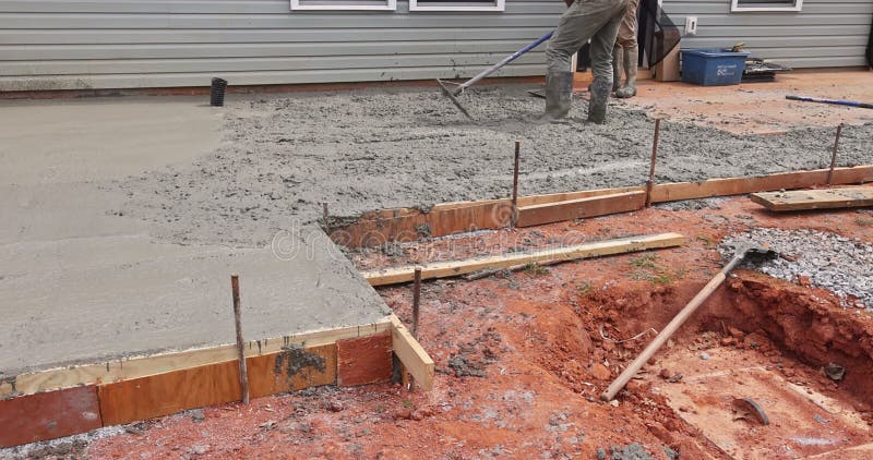 During Construction of Foundation, a Mason Leveled Screeding Concrete ...