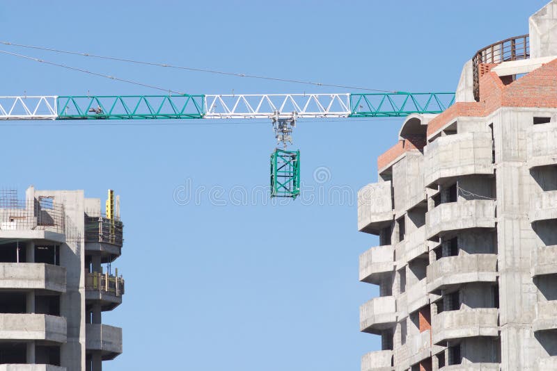 Construction Frame on Crane between Buildings Stock Photo - Image of ...
