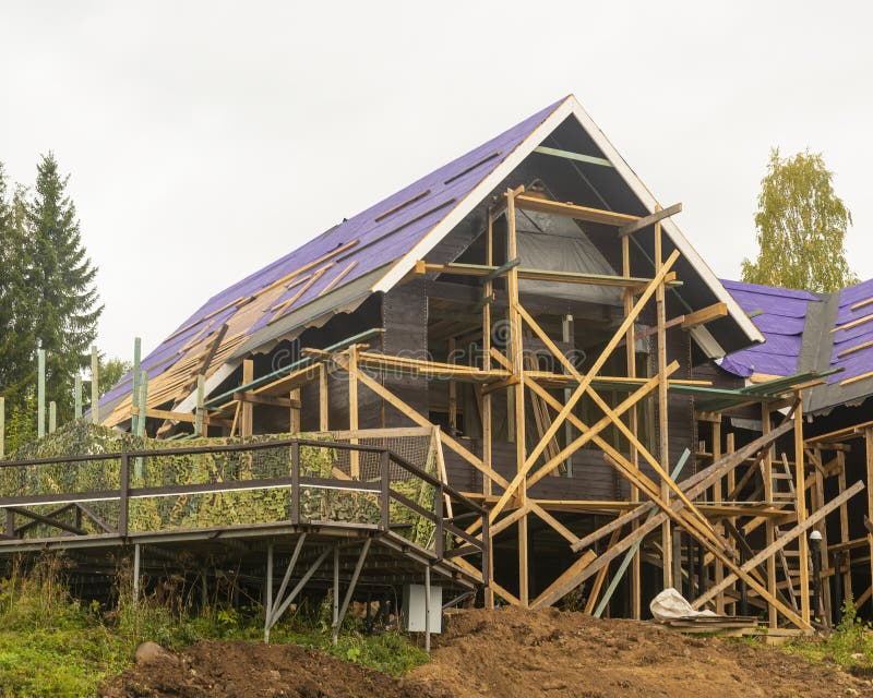 Construction of a Frame House on a High Bank. Stock Photo - Image of ...