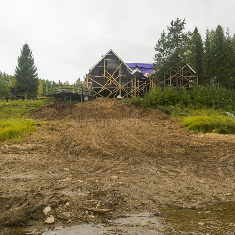 Construction of a Frame House on a High Bank. Stock Photo - Image of ...
