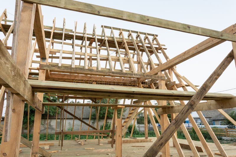 Wooden Rafters of a New Home Under Construction at Sunset Stock Image ...