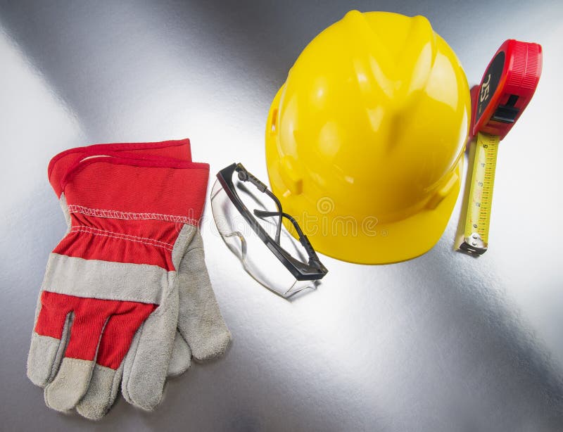 Construction Gear on Silver Tabletop with Hardhat Stock Photo - Image ...