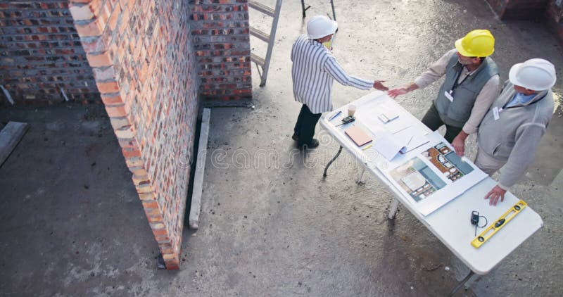 Construction, Handshake and Architects Planning Building, Development ...