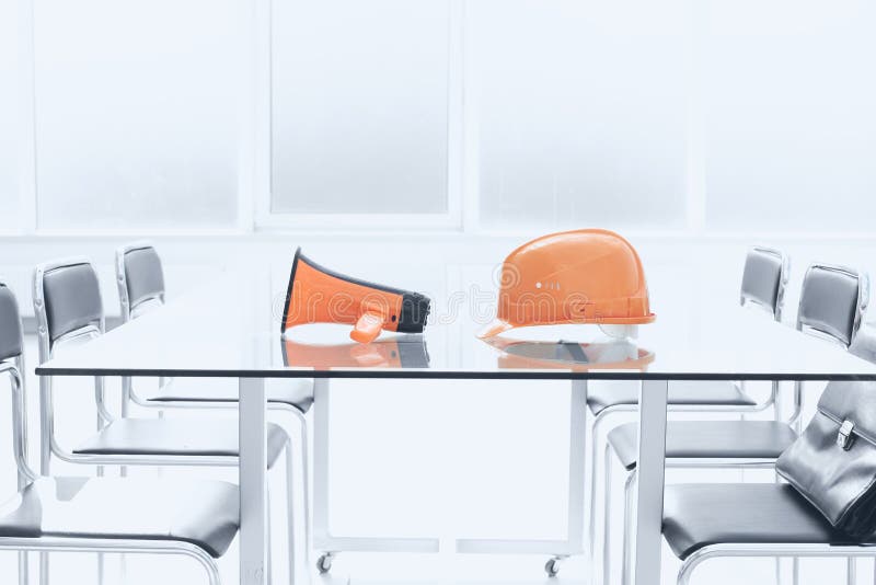 Construction Helmet Loudspeaker on Glass Table in Bright Office Space ...
