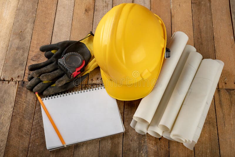Construction Helmet and Roll of Parchment with Design. Construction ...