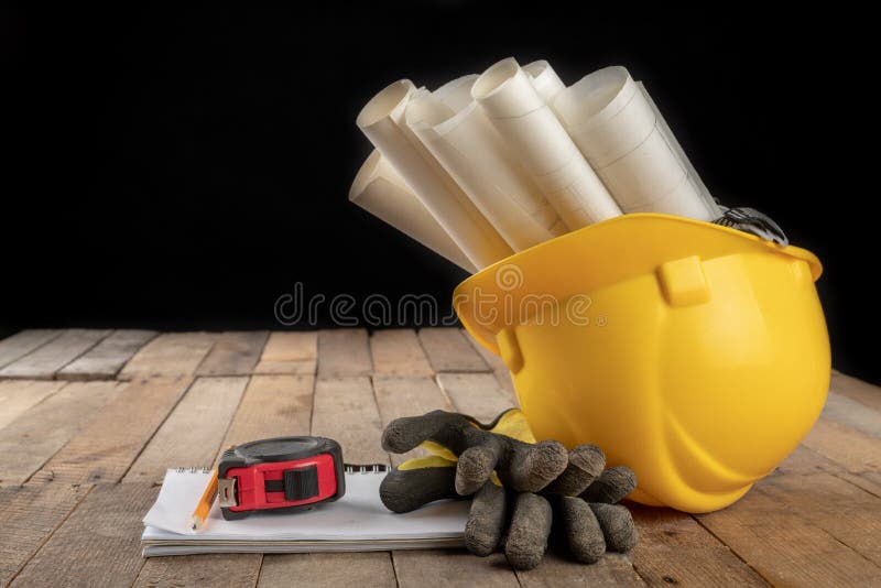 Construction Helmet and Roll of Parchment with Design. Construction ...