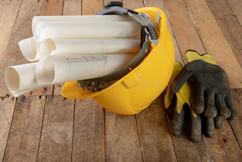 Construction Helmet and Roll of Parchment with Design. Construction ...