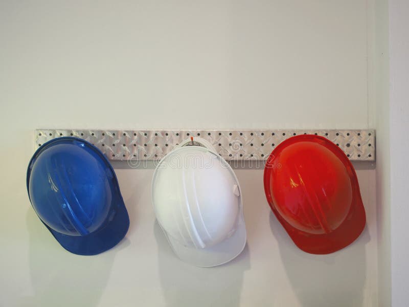 Construction Helmets Hanging on the Wall Stock Image - Image of ...