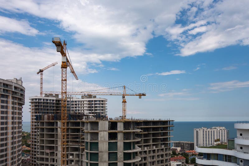 The Construction of a High-rise Apartment Building on the Seashore ...
