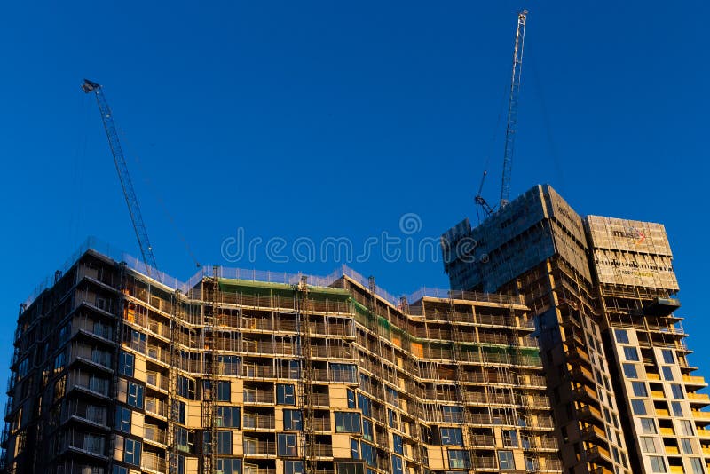 Construction of High-rise Building. Construction Cranes and Skyscraper ...