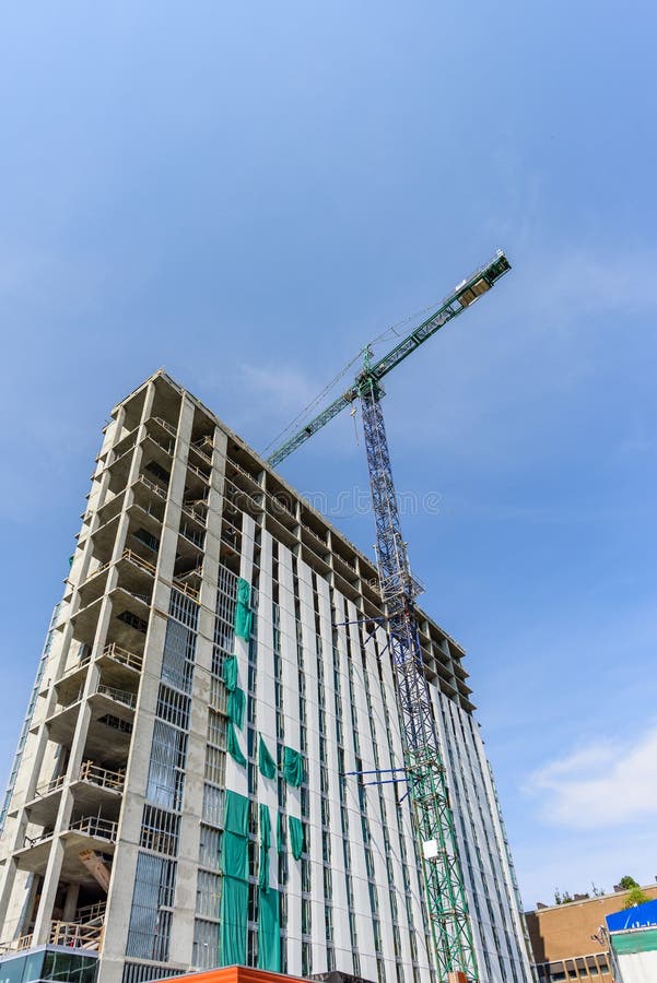 Construction of a High-rise Building with a Crane Stock Photo - Image ...