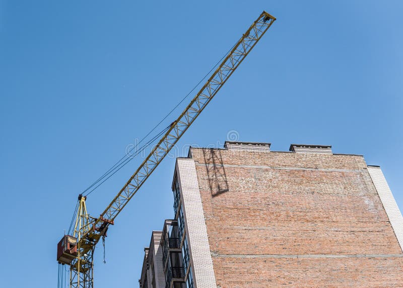 Construction of a High-rise Building with a Crane. Building ...