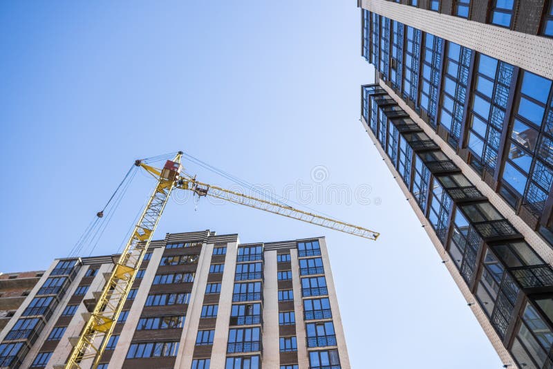 Construction of a High-rise Building with a Crane. Building ...