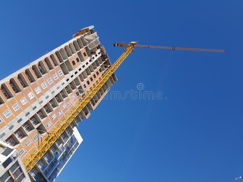 Construction of a High-rise Building with a Tower Crane Stock Image ...