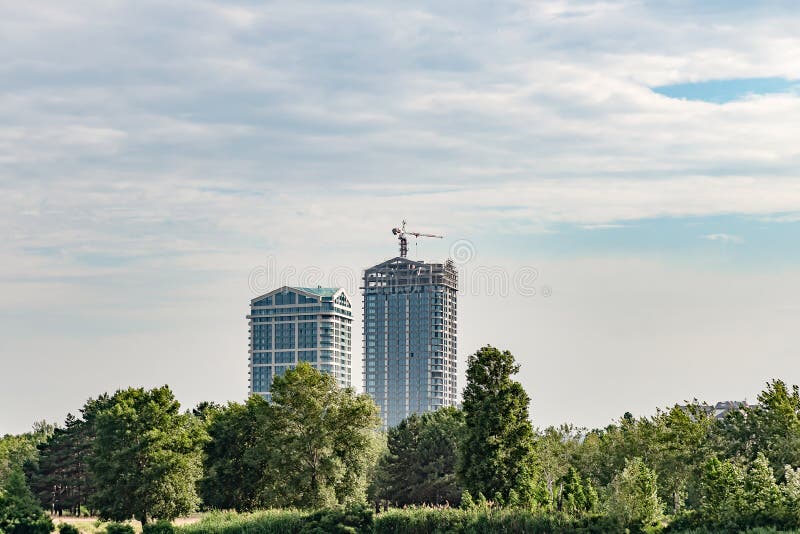 Construction of High-rise Buildings, Skyscrapers. Tower Cranes are at a ...