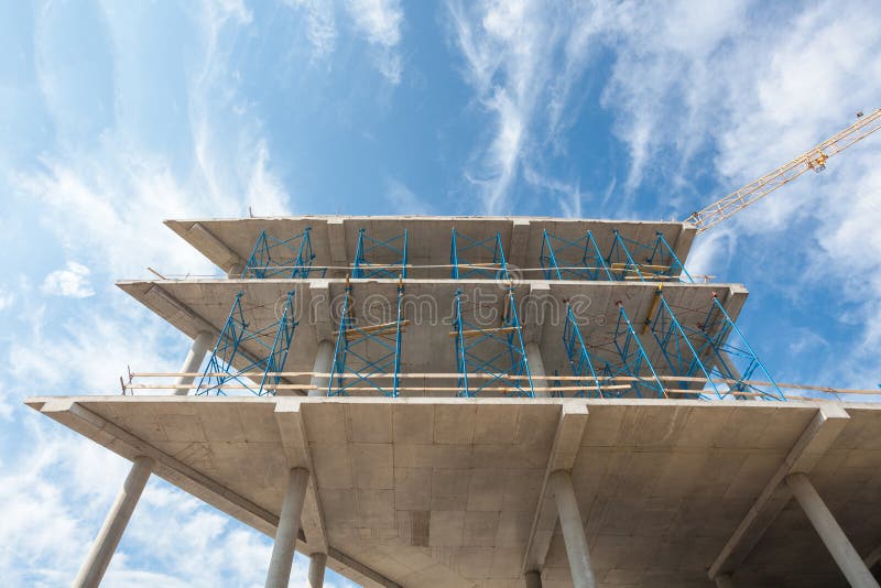 Construction of High-rise Corner Building. Crane and Building ...