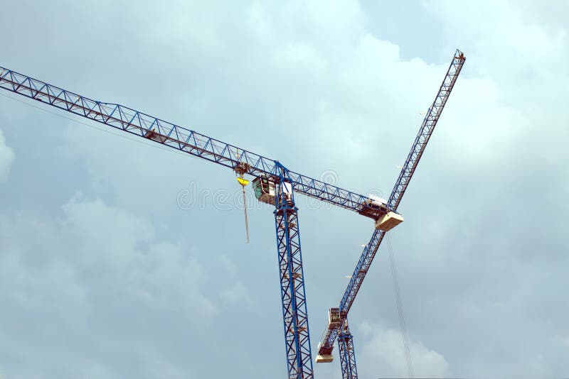Construction Hoisting Tower Cranes Stock Photo - Image of clouds, cloud ...