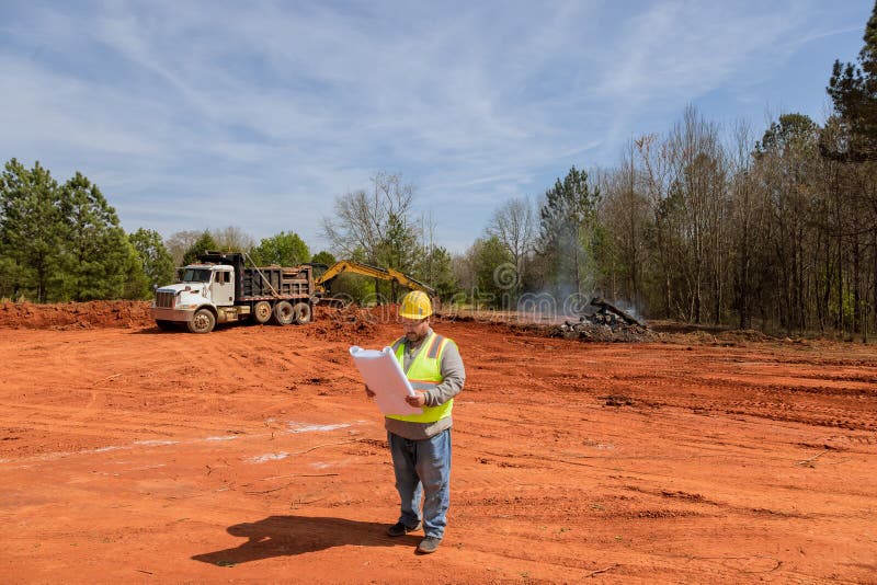 During Construction on a House Project, a Supervisor in a Hard Hat ...