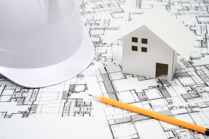 Construction Industry Concept with a Hard Hat on Architectural Drawing ...