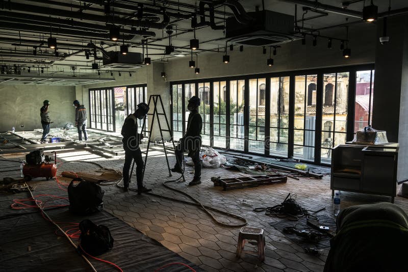 Construction Industry Workers Working Inside Modern Building Site in ...